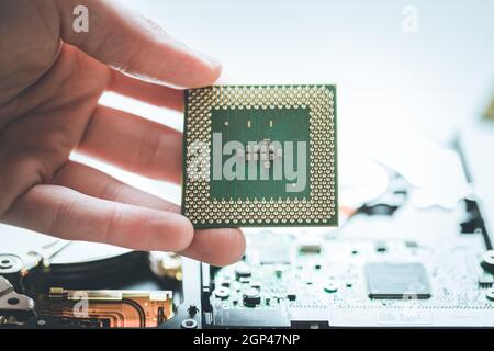 Male hand is holding a cpu, close up; Computer technology Stock Photo ...