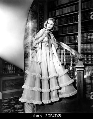 PRIVATE NUMBER, Loretta Young, in a blue starched highly ruched dress by Gwen Wakeling, 1936. TM ...