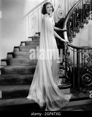 PRIVATE NUMBER, Loretta Young, in a blue starched highly ruched dress by Gwen Wakeling, 1936. TM ...