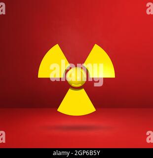 Radioactive symbol isolated on a red studio background banner. 3D ...