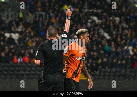 Referee Matthew Donohue gives a yellow card to Trai Hume of Sunderland ...