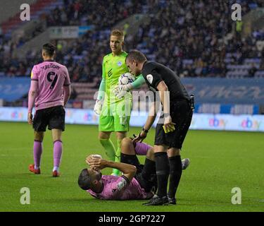 Referee Samuel Barrott checks on Phil Foden of Manchester City as he ...