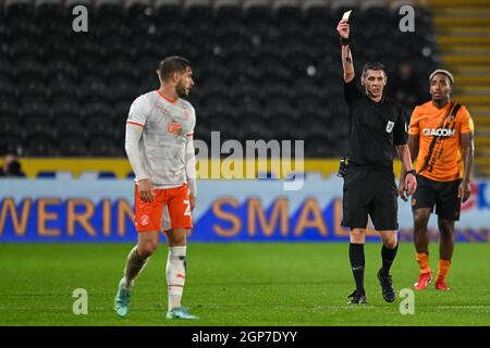 Referee Matthew Donohue gives a yellow card to Trai Hume of Sunderland ...
