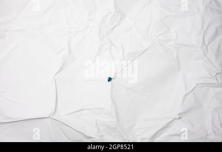 crumpled white paper, creases and a hole Stock Photo - Alamy
