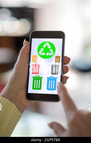 Smartphone screen displaying a recycling concept Stock Photo - Alamy