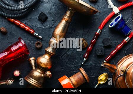 Eastern shisha or hookah for relaxation with a kettle with tea Stock ...