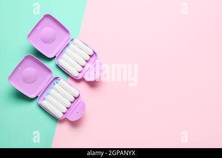 Tampons storage boxes on colorful background, top view Stock Photo - Alamy