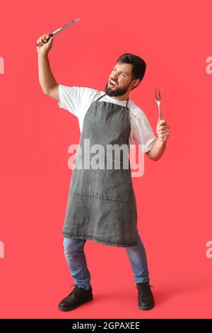 Man dressed as butcher for Halloween on color background Stock Photo ...