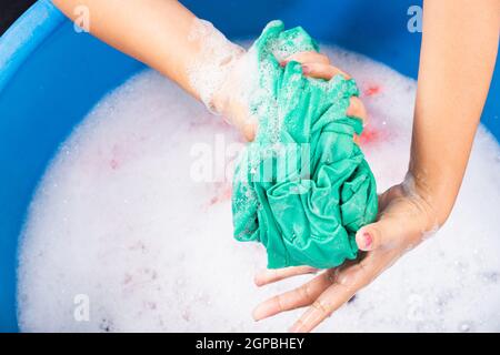 Female squeeze wring out wet fabric cloth Stock Photo - Alamy