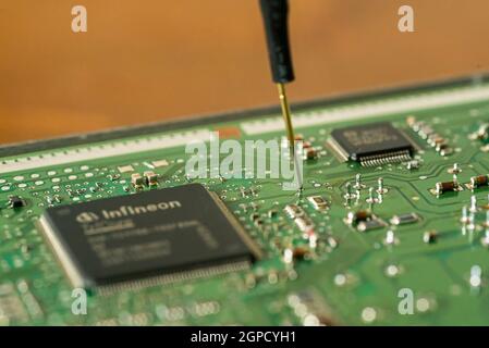 MILAN, ITALY 5 APRIL 2021: Macro detail of Car ecu bench reading method ...