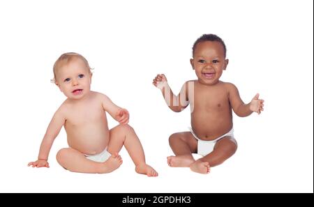 Two happy babies of different races isolated on a white background ...