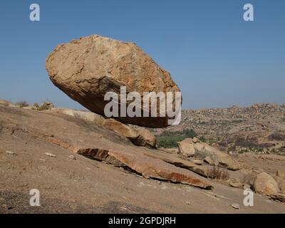 Big balancing granite boulder in Sanapur, villige near Hampi, India ...