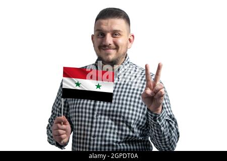 White guy holding a flag of Syria and shows the class by hand isolated ...