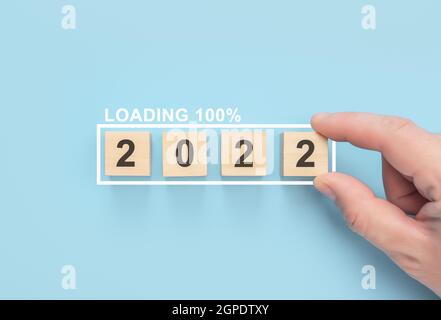 Hand putting card in time clock cut out on white background Stock Photo ...