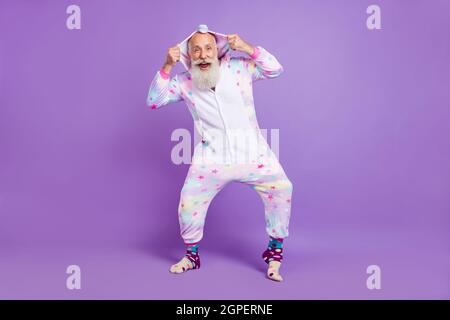 Photo of surprised funky man wear trendy yellow shirt hold his new ...