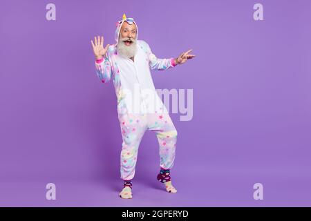 Photo of dreamy funny man wear turquoise clothes talking modern device ...