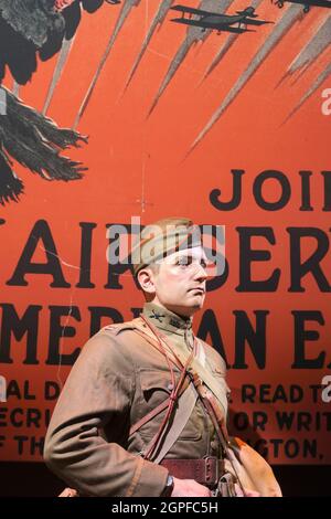 Soldiers in front of WWI recruiting, propaganda posters. At the ...