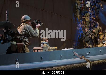 A Higgins landing craft transport boat loading soldiers during D-Day in ...