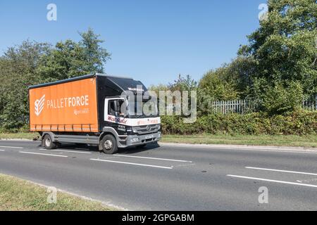 PalletForce delivery truck travelling on uphill country A Road. For UK ...