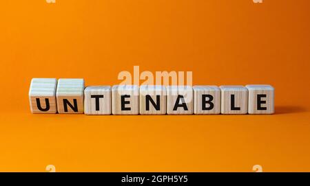 Tenable or untenable symbol. Turned wooden cubes and changed the word ...