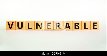 Vulnerable symbol. The word Vulnerable on wooden cubes. Beautiful ...