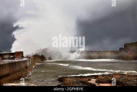 Huge waves crash & spray over the sea wall and flood Meadfoot Sea road ...