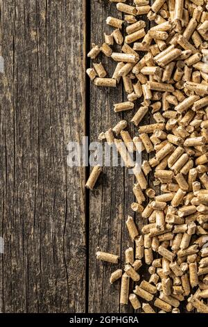 Wooden pellets on the wooden table. Top view Stock Photo - Alamy