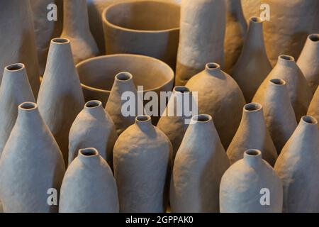 Large collection of gray ceramic vases in various sizes and textures at ...