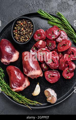 Raw chicken hearts ready for cooking on the wood background Stock Photo ...