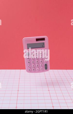 Math arrangement with calculator floating Stock Photo - Alamy