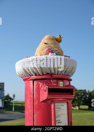 Guerilla Crochet / knitted beehive and bees post box topper on a ...