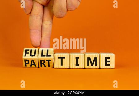 Full or part time symbol. Businessman turns wooden cubes and changes ...