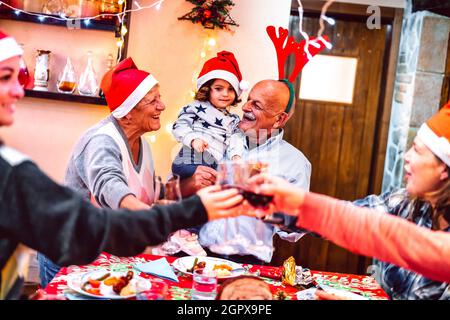 Happy kids having fun and opening presents near christmas tree Stock ...