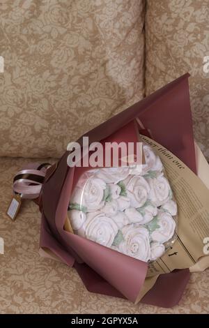 Marshmallow bouquet packed in craft paper. Zephyr rose flowers Stock Photo - Alamy