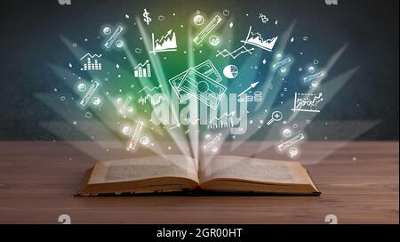 Open book with profit icons above Stock Photo - Alamy