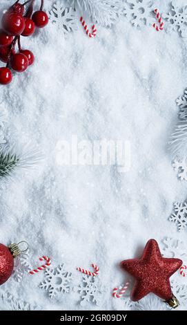 Christmas branches with rowan, candy cane and snow on grunge background ...