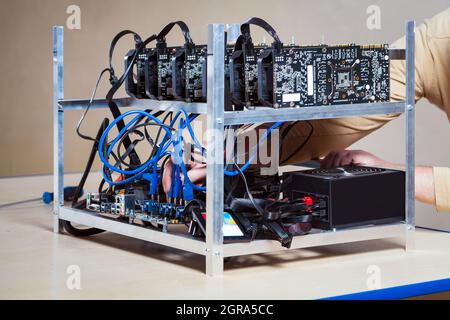 Device for mining crypto currency. Row of bitcoin miners set up on the ...