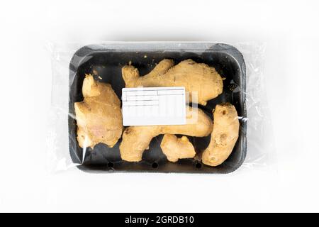 Freshly harvested ginger in a labeled pack on white background Stock ...