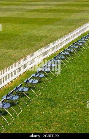 cricket pitch with white fence Stock Photo - Alamy