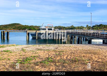 Torres Straits Ferry tied up with tourists waiting to board at Seisia ...