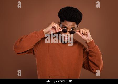 Photo of cool young brown hairdo man dance look empty space wear white ...