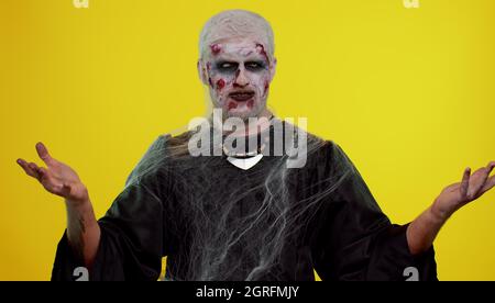 Upset frustrated annoyed man Halloween zombie bloody wounded makeup ...