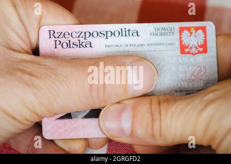 Polish ID card held in hand, Identity document Stock Photo - Alamy
