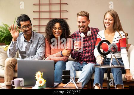 Young friends group sharing info on streaming platform with webcam ...
