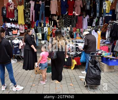 Shoppers looking for clothing at Birmingham Bullring Rag Market, UK ...