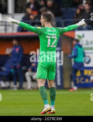 Luton, UK. 02nd Oct, 2021. Kal Naismith #4 of Luton Town battles with ...