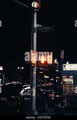 A vertical closeup shot of a Stop sign and one-way sign put on a ...