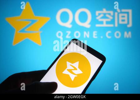 In this photo illustration, the Qzone logo seen displayed on a mobile ...