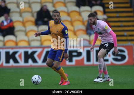 . Mansfield Town's Jordan Bowery in action with Barrow's James Jones ...