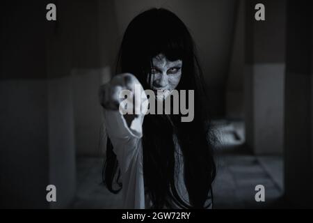 Woman ghost horror her finger point your face, halloween concept Stock ...